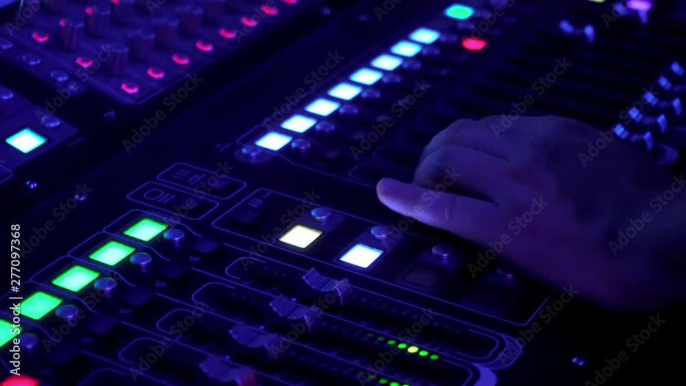 Remote control for adjusting the sound. Audio mixer. Sound engineer ...