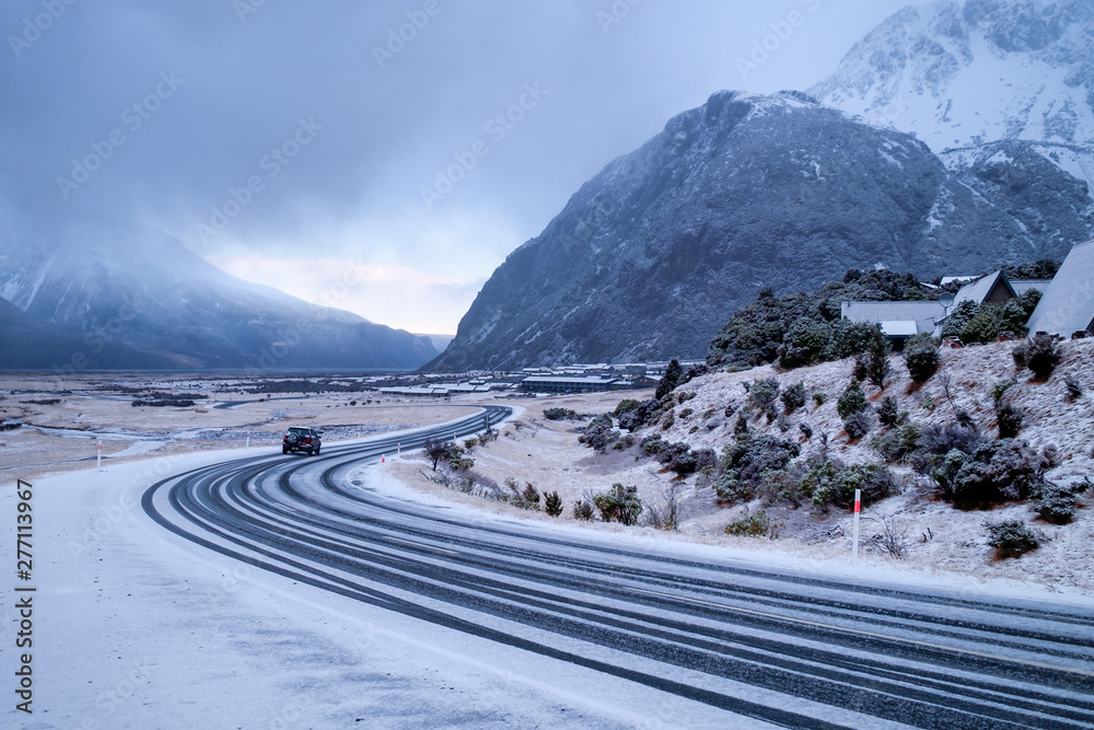 Winter driving road at Mount Cook village in New Zealand. Icy road ...