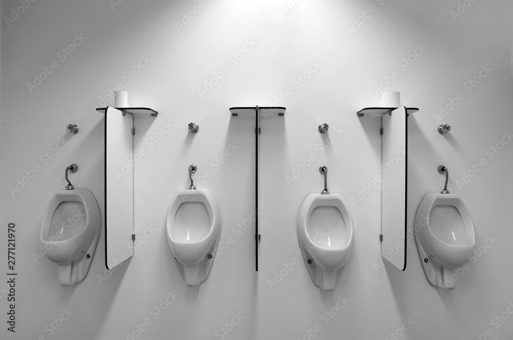 Public restroom urinal. Stock Photo | Adobe Stock