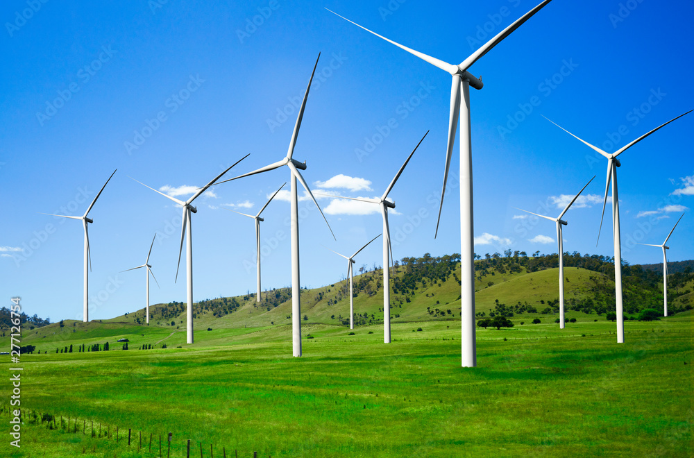 Wind turbine farm power generator in beautiful nature landscape for ...