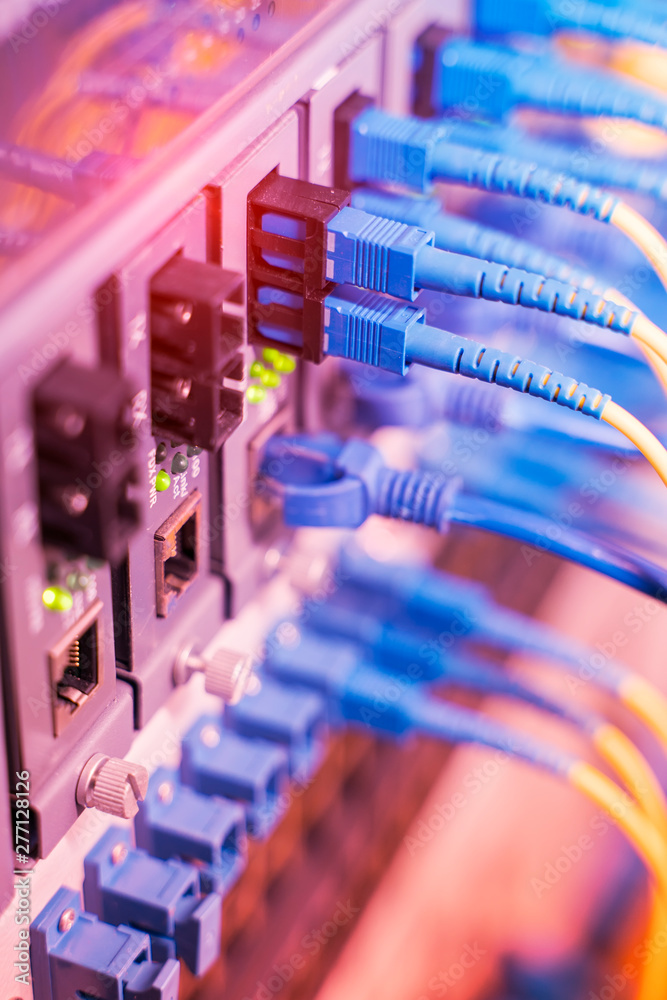 Fiber Optic cables connected to optic ports and UTP, Network cables ...
