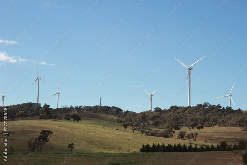 Foto de panoramic views of multiple windmills at a modern wind farm ...