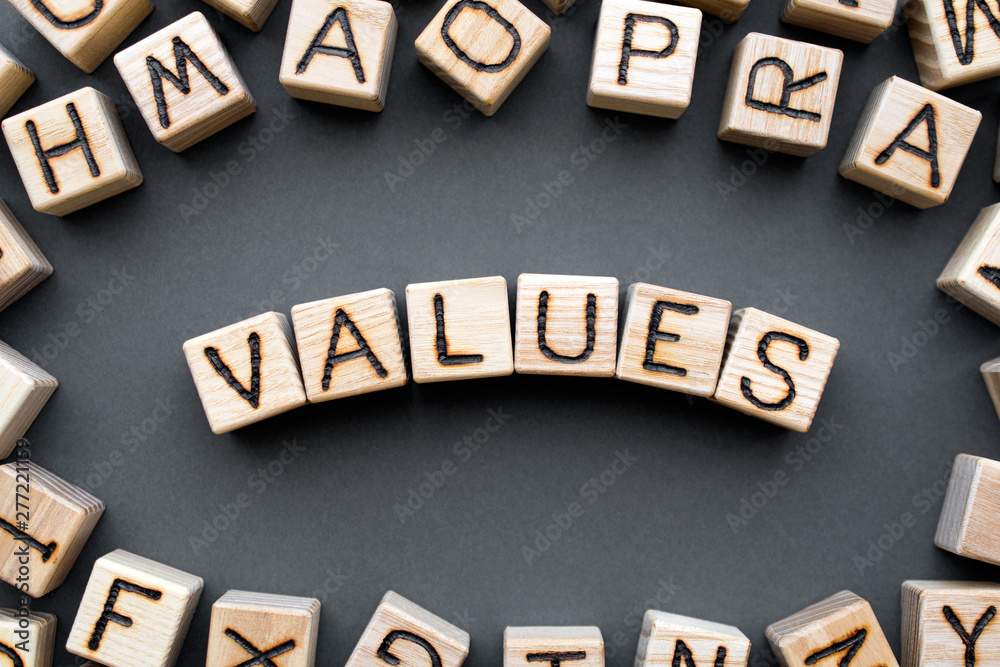 word values composed of wooden cubes with letters, core values are the ...