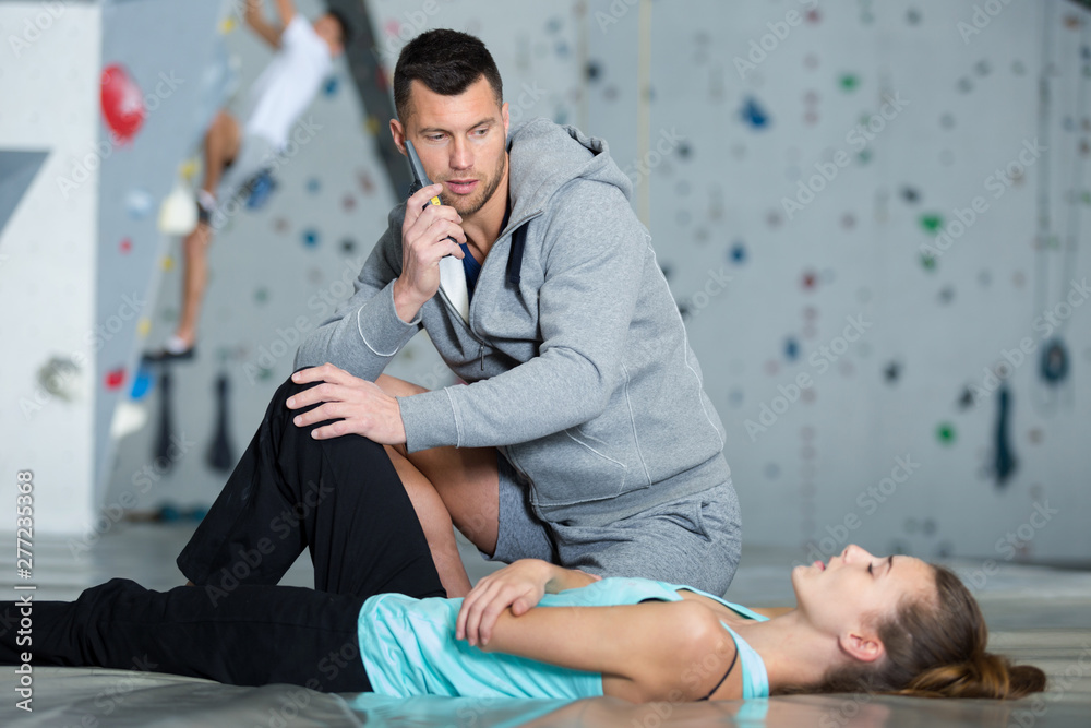 man calling for help for fallen climber in activity center Stock Photo ...