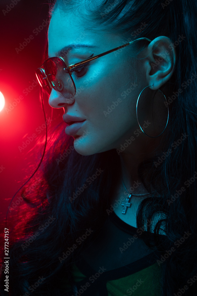 Sensual woman in red light portrait. Beautiful young female model in ...