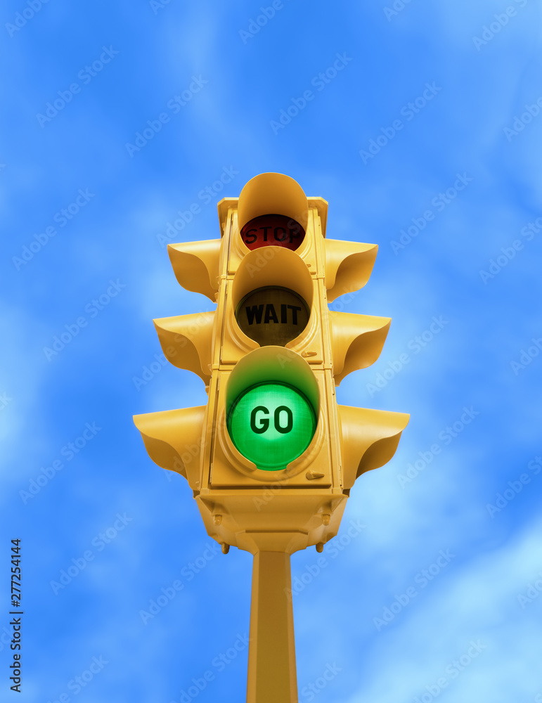 Vintage traffic light with green GO light on blue sky background Stock ...