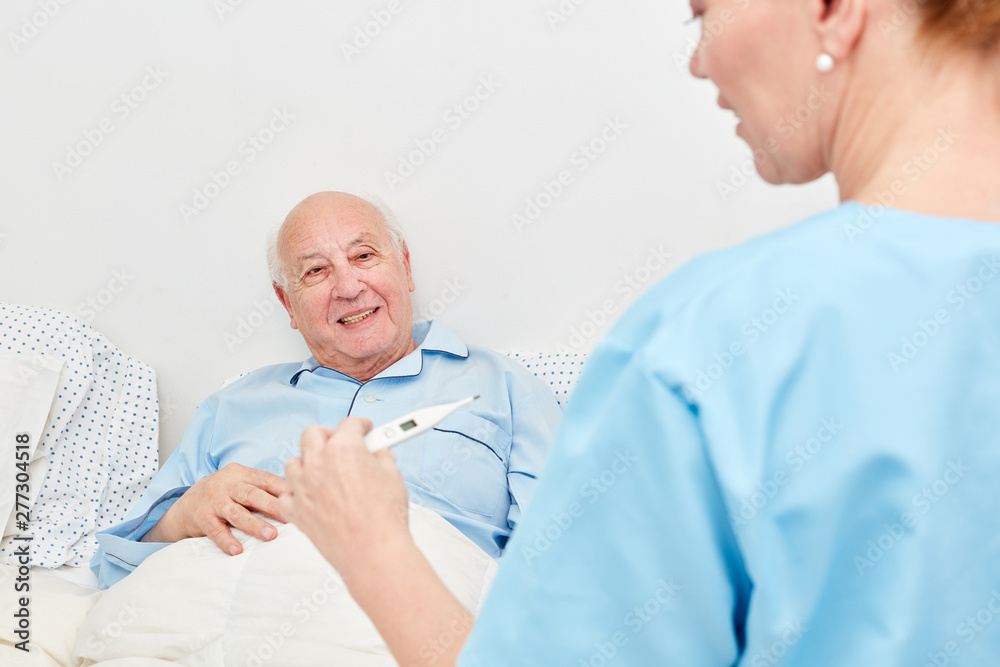 Nurse with fever thermometer Stock Photo | Adobe Stock