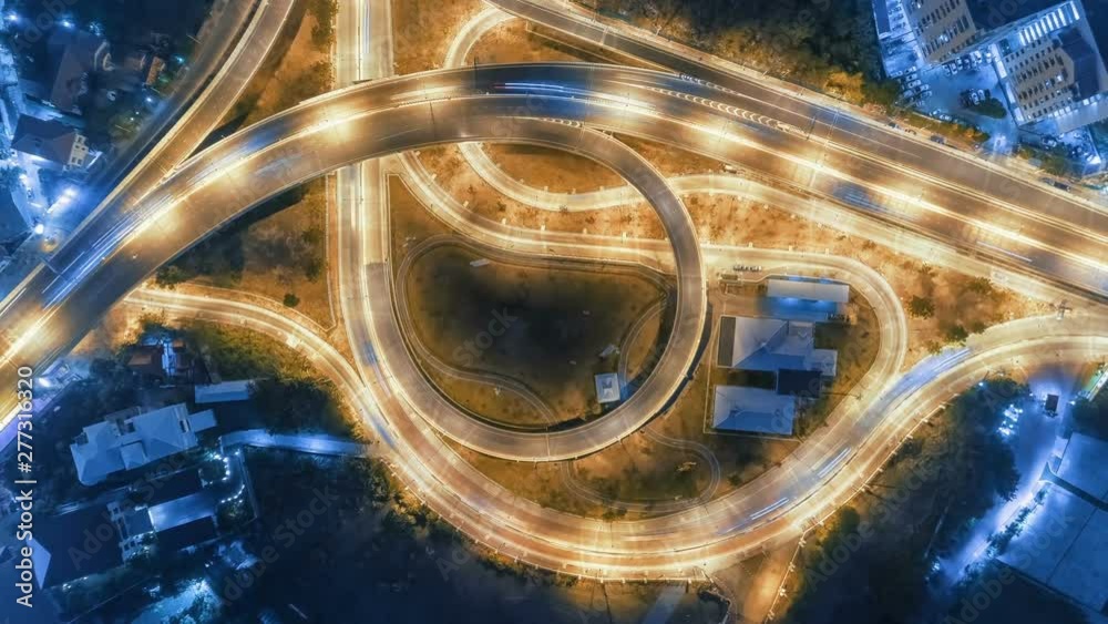 Hyperlapse timelapse of night city traffic on 4-way stop street ...