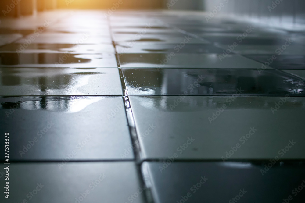 Spilled water leak on the floor of building. Wet floor from rainy ...