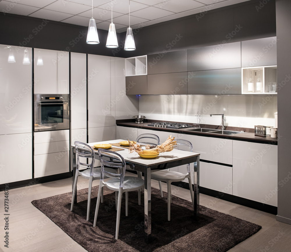 Modern luxury fitted kitchen with center table Stock Photo | Adobe Stock