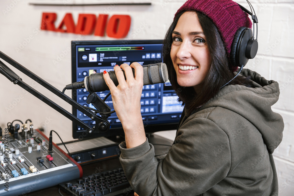Beautiful happy young female radio host broadcasting Stock Photo ...