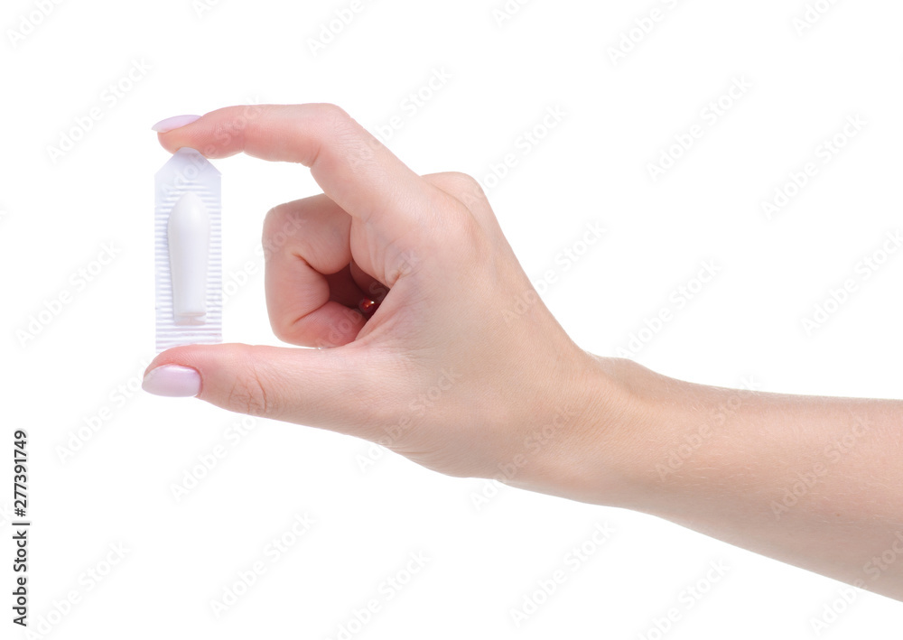 Suppositories in hand health medicine on a white background. Isolation ...