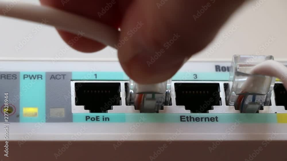 Connecting the plugs in the wifi Internet router vídeo de Stock | Adobe ...