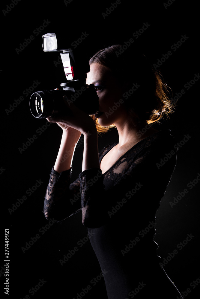 Asian Woman Photographer hold camera with external flash point to shoot ...