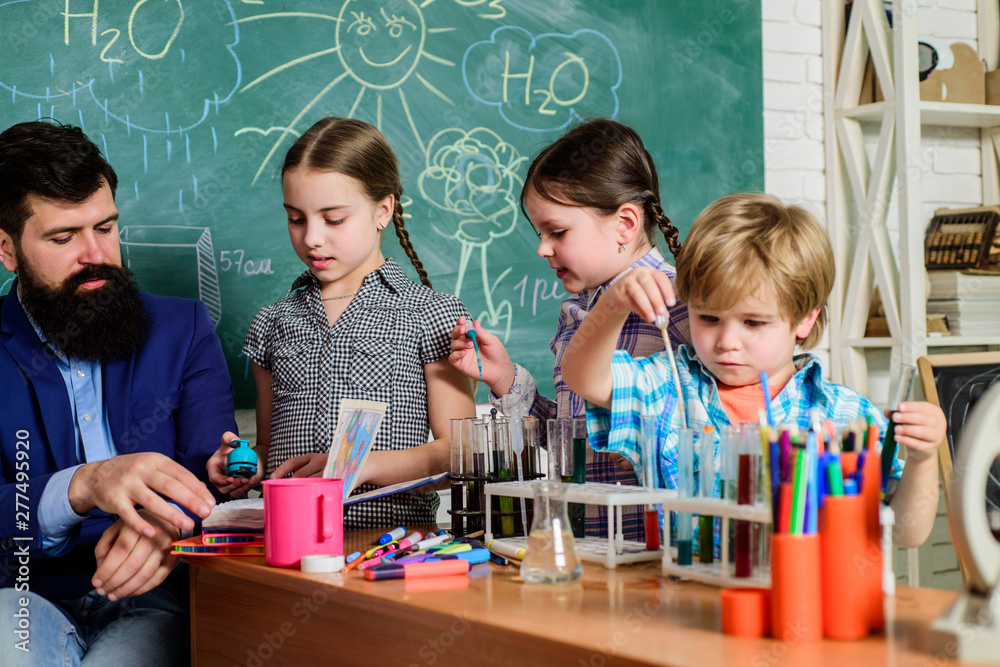 students doing science experiments with microscope in lab. school kids ...