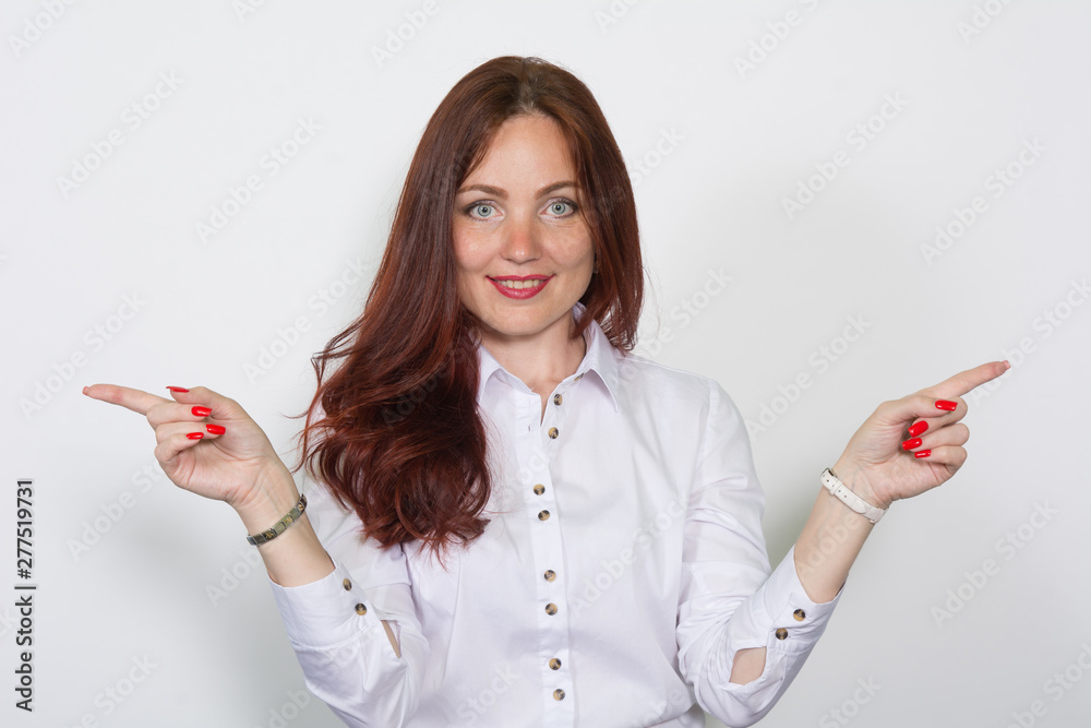 Beautiful woman pointing her fingers in different directions isolated ...