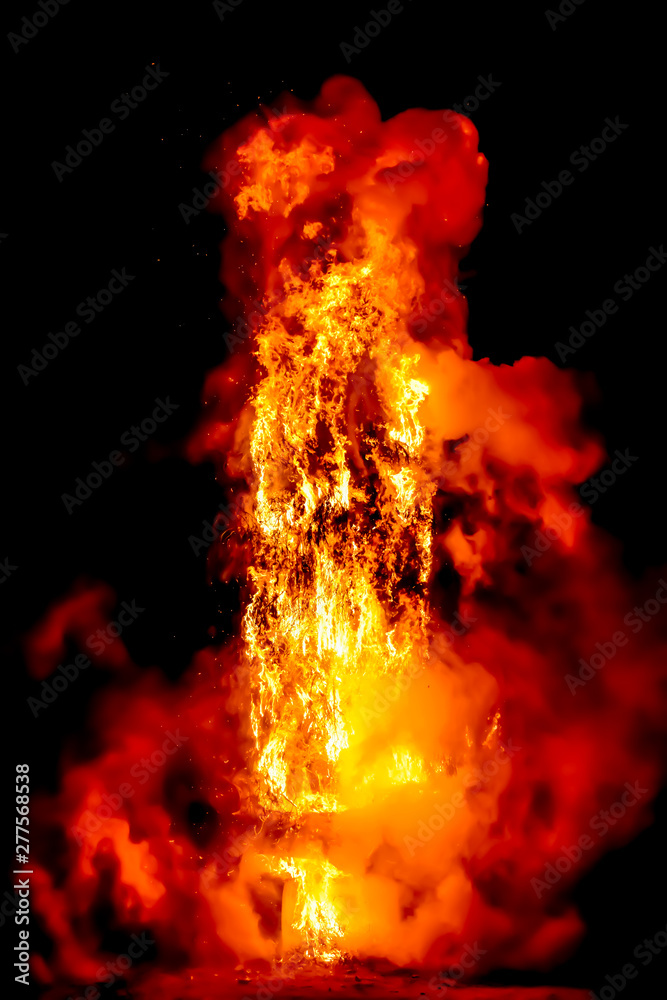 amazing violent explosion of fire in the dark night. The combustion ...