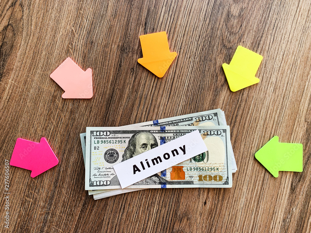 Payments alimony. Pile Dollars with sign alimony and money. Divorce and ...