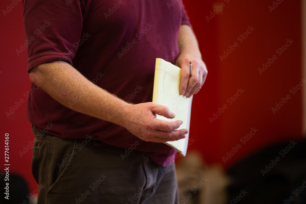 Professor holding a notebook giving his lesson. Giving instructions ...