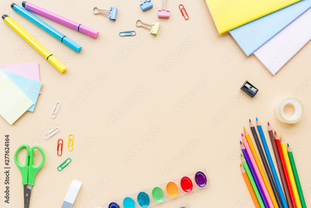 School supplies stationery, colour pencils, paints, paper on pastel ...
