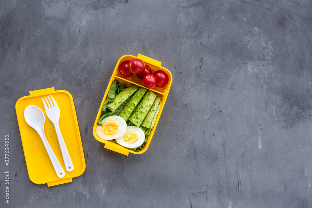 School supplies and lunch box with sandwich and vegetables. Back to ...