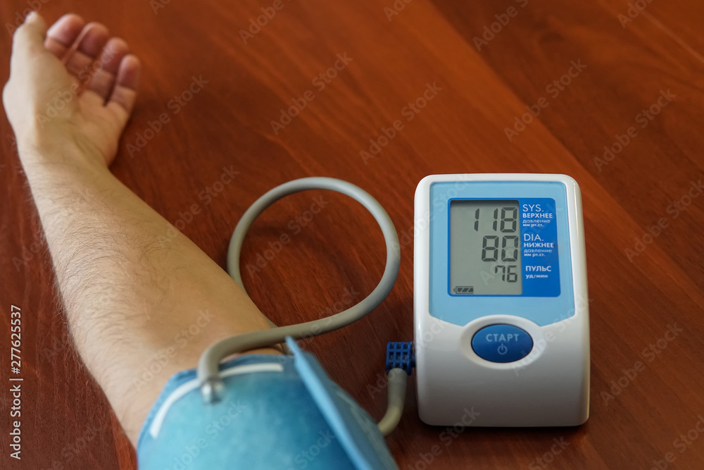 Men's health check blood pressure.and heart rate with digital pressure ...