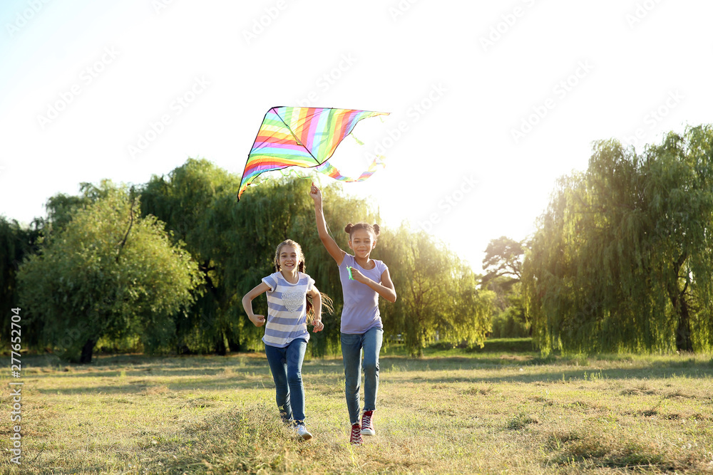 Children flying kite on summer day Stock Photo | Adobe Stock