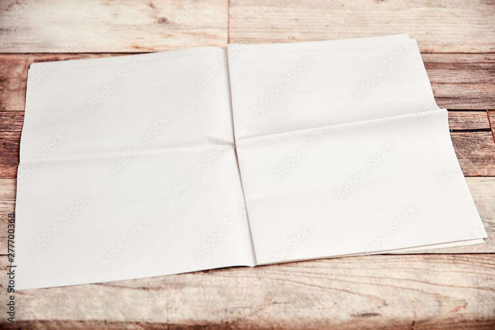 Open newspaper with blank unprinted pages Stock Photo | Adobe Stock