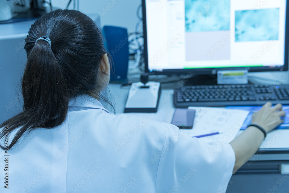 Asian scientist working in the lab,Experiment for customer,Using the ...