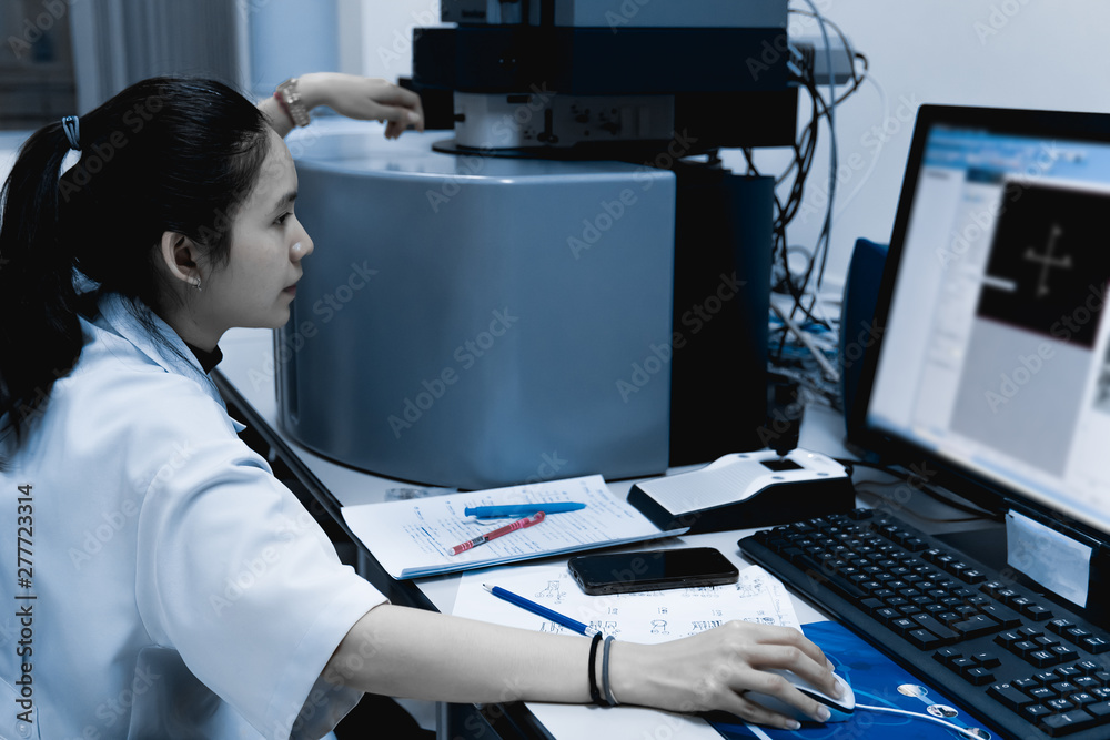 Asian scientist working in the lab,Experiment for customer,Using the ...