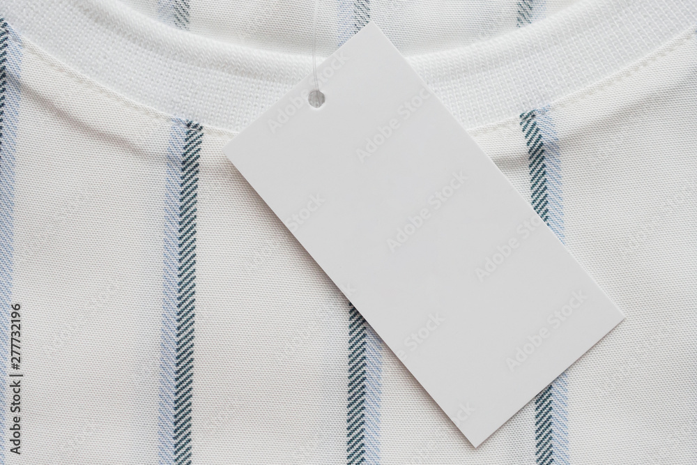 Blank white clothes tag label on new shirt Stock Photo | Adobe Stock