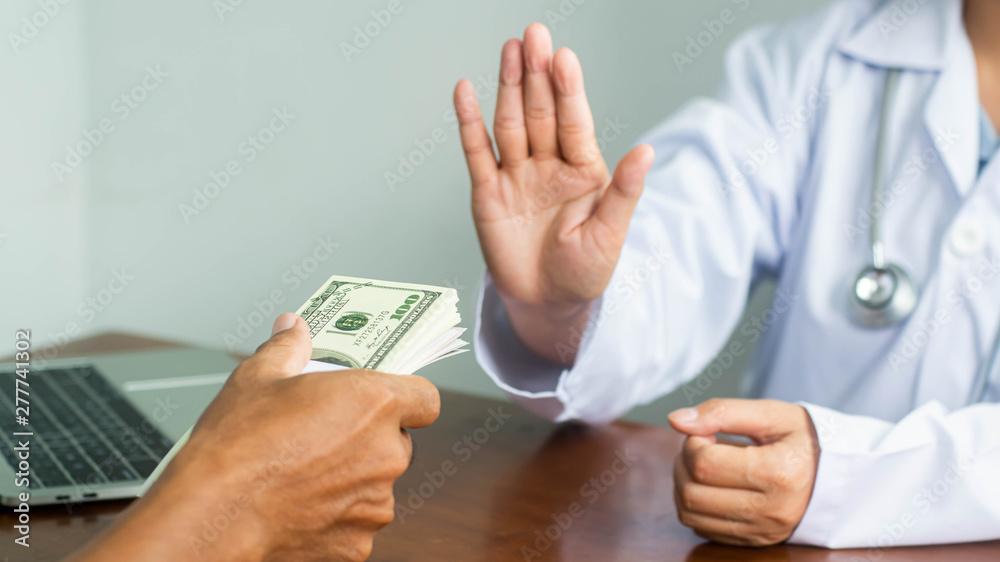 The patient's hand is sending money to the doctor for bribery in ...