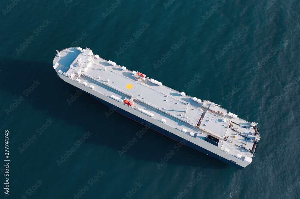 Aerial view of high-speed sea vessel for transportation of cargo vessel ...