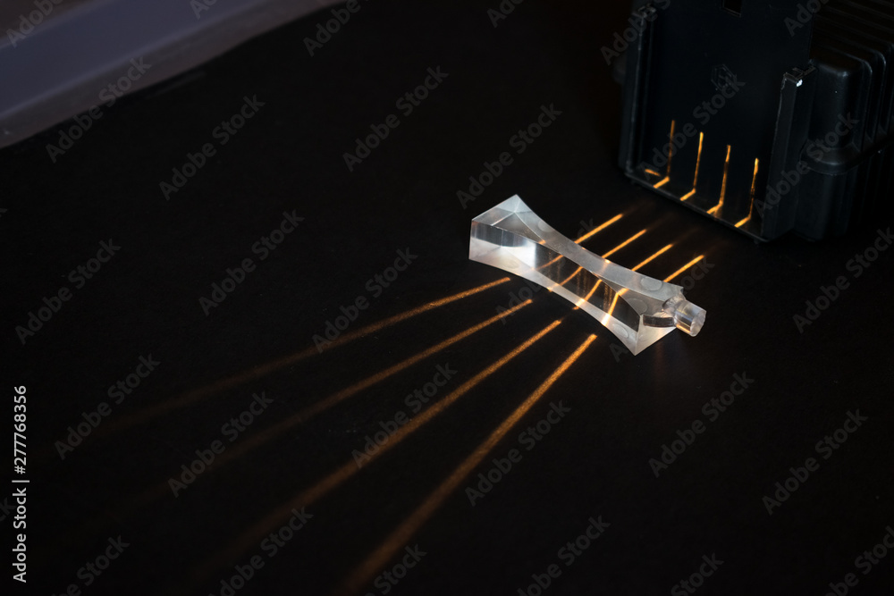 Light beams pass through a negative lens, showing a divergent pattern ...