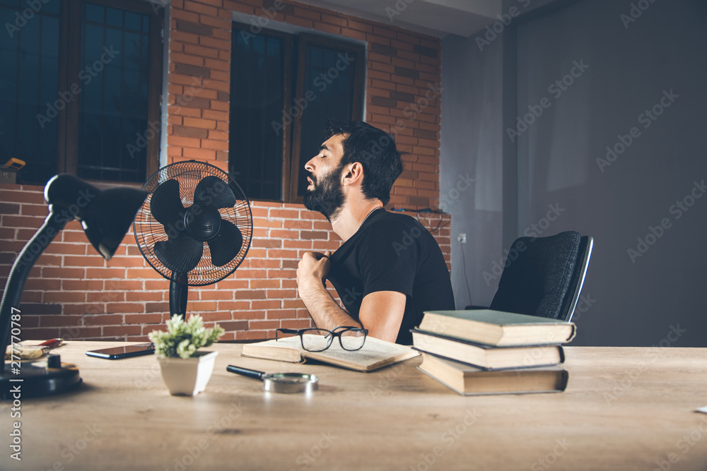 cooling Fan with working man in the office Stock Photo | Adobe Stock