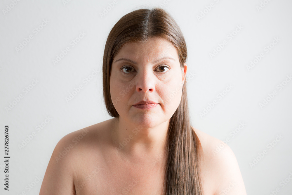 One side lighting in studio portrait. Main light hitting only one side of the face in ninety ...