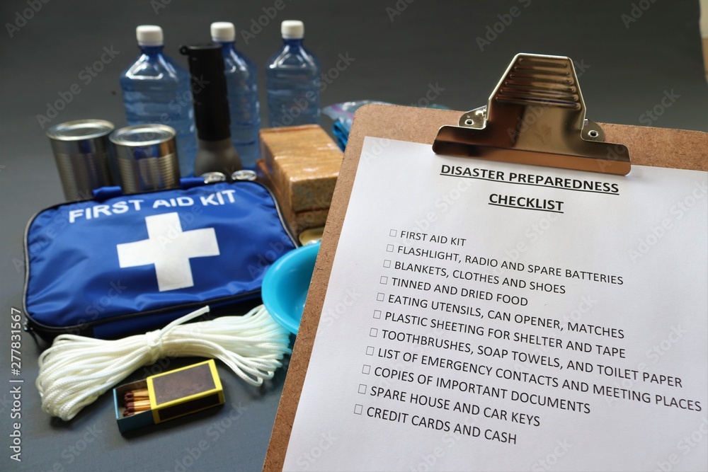 Disaster preparedness checklist on a clipboard with disaster relief ...