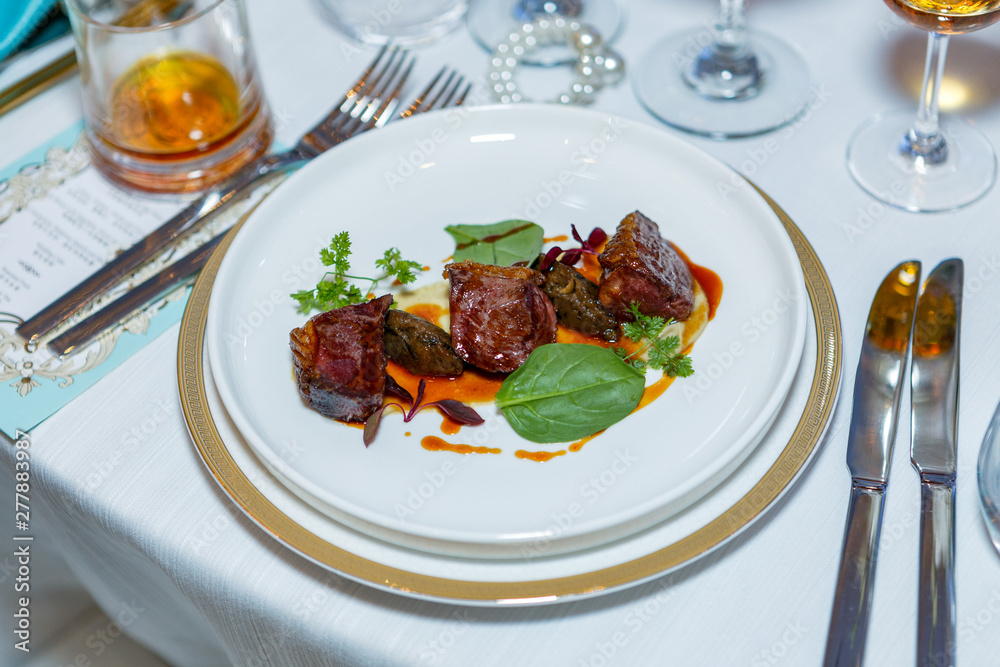 Beautifully presented dish of meat and vegetables. Tasty grilled meat ...