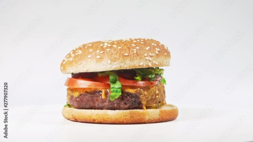 Tasty Burger or Cheeseburger on White Background Spinning and Rotating ...