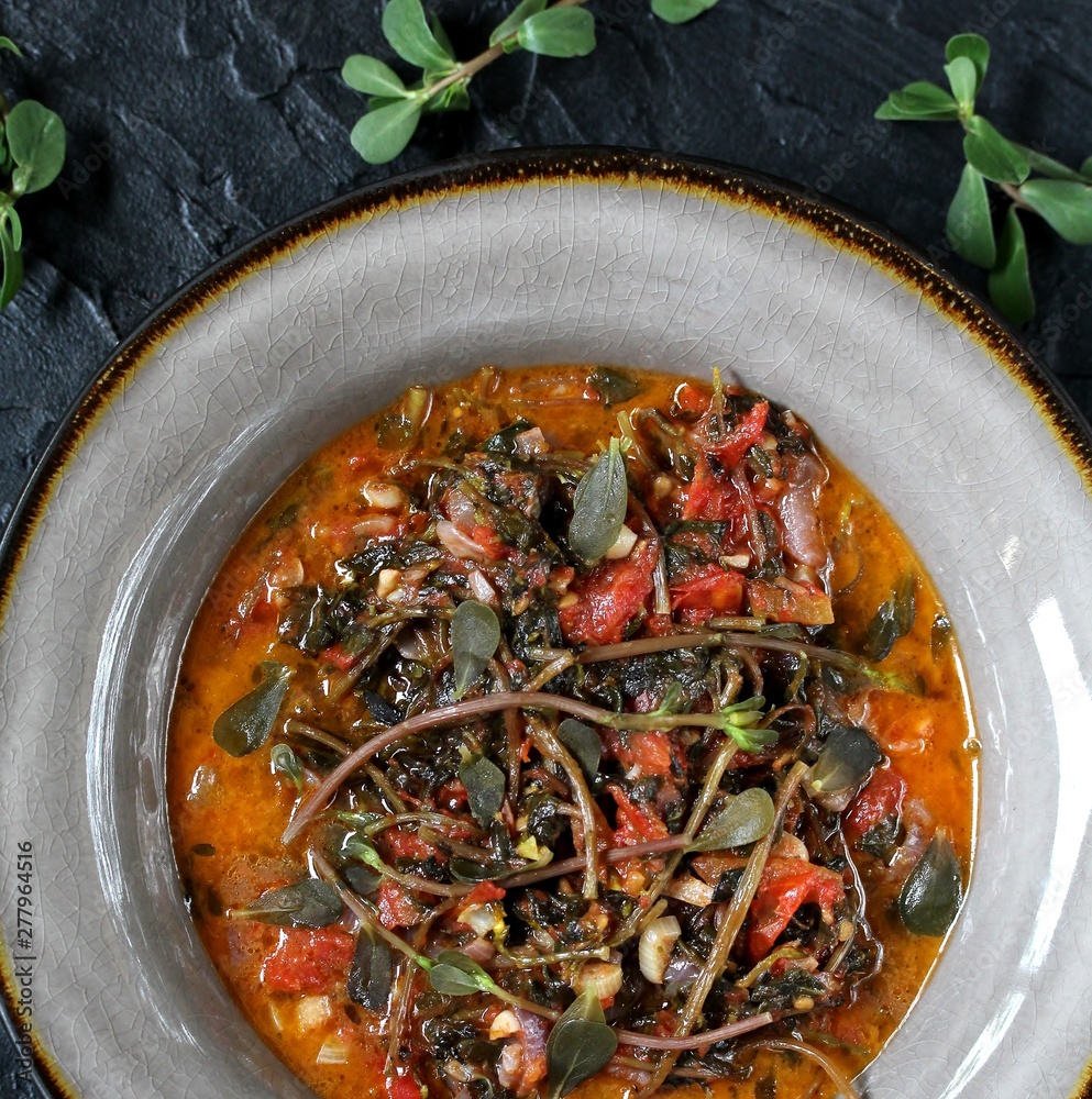 dish of purslane. potulak-edible useful weed. stalks of purslane stewed ...