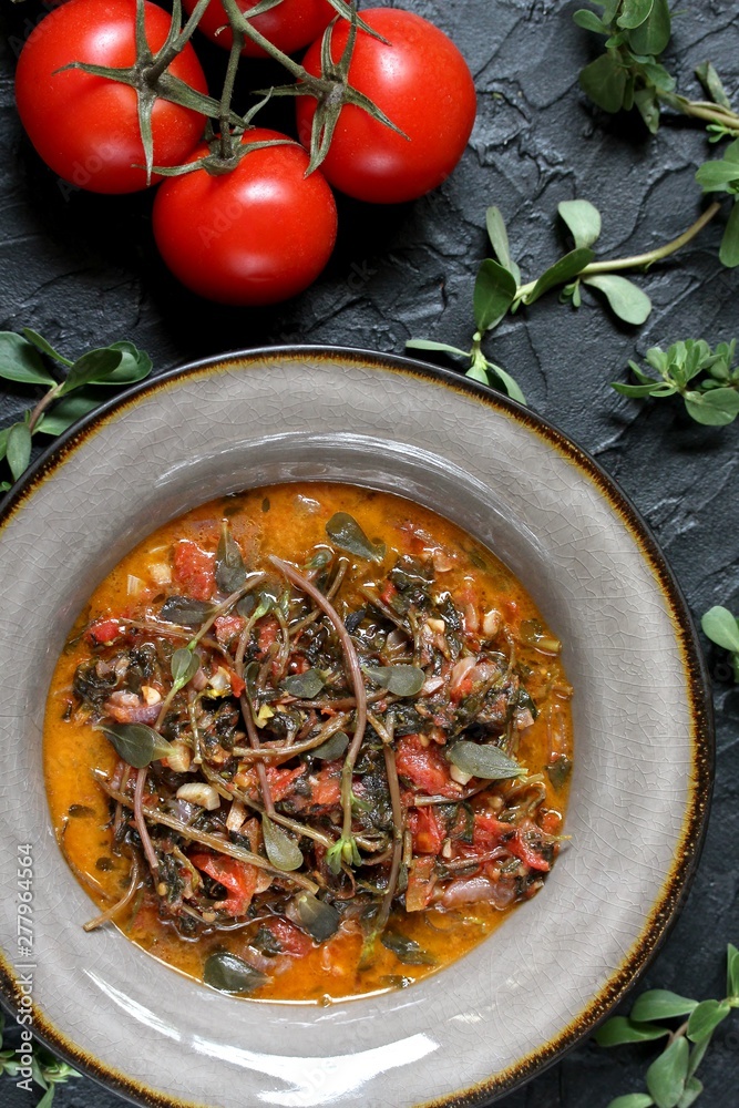dish of purslane. potulak-edible useful weed. stalks of purslane stewed ...
