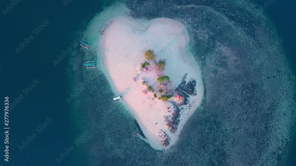 Beautiful top down view of Gili Kedis island with white sand and clear ...