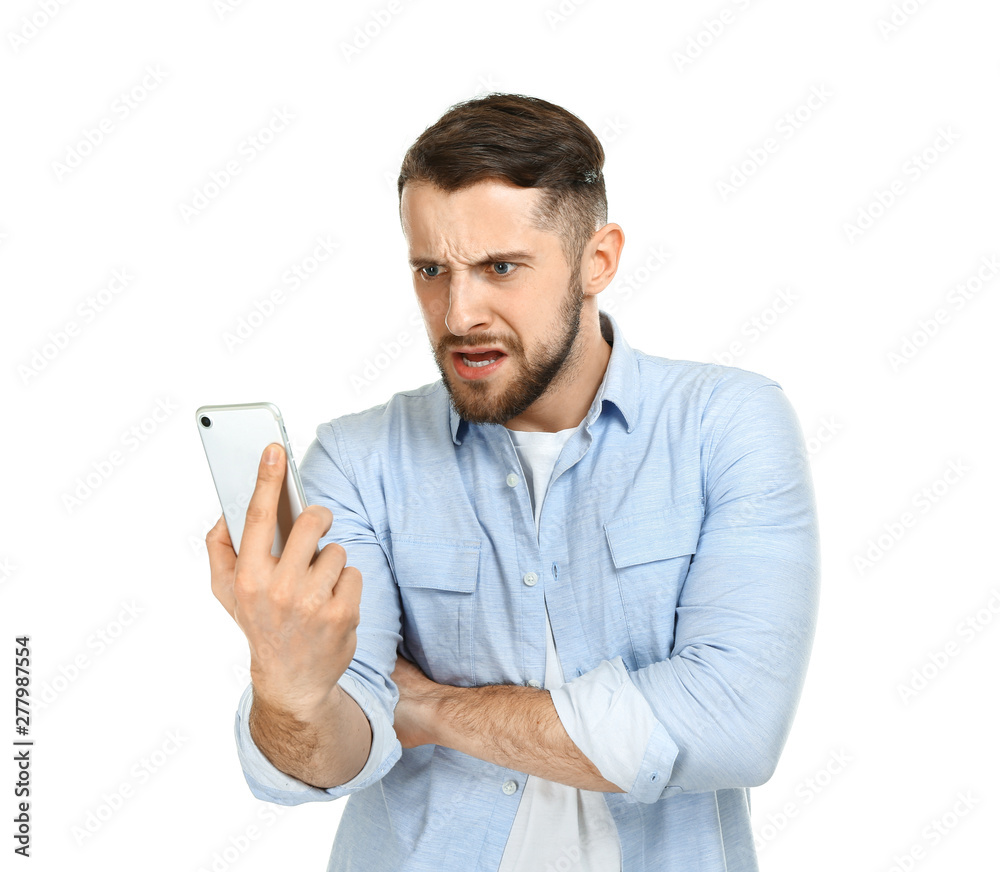 Angry man with mobile phone on white background Stock Photo | Adobe Stock