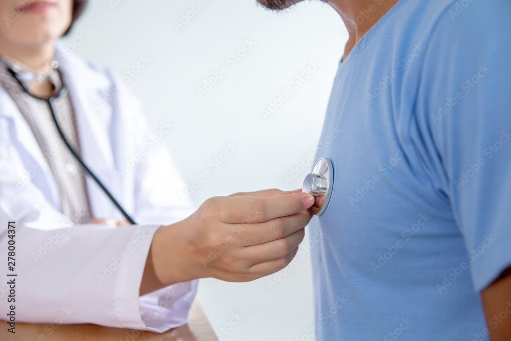 Asian female doctor checking patient heart rate in the hospital. Stock ...