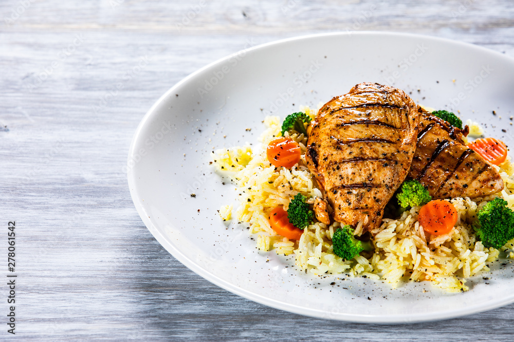 Grilled chicken fillets, rice and vegetables Stock Photo | Adobe Stock