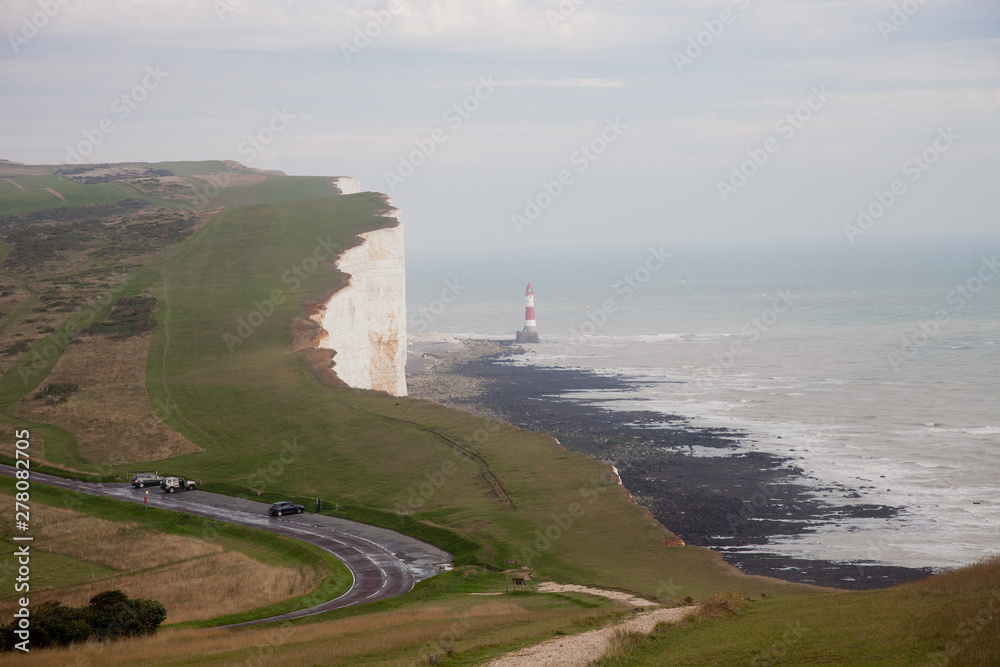 White chalk cliffs and Beachy Head Lighthouse. Eastbourne, East Sussex ...