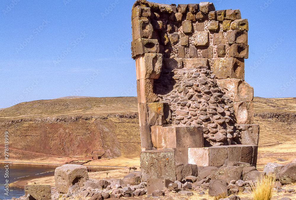 Ruins of a pre-Inca tower at the archaeological site of Sillustani on ...