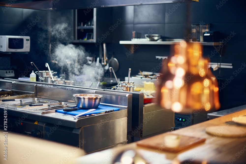 Restaurant kitchen interior: bar counter made of natural stone, fences ...