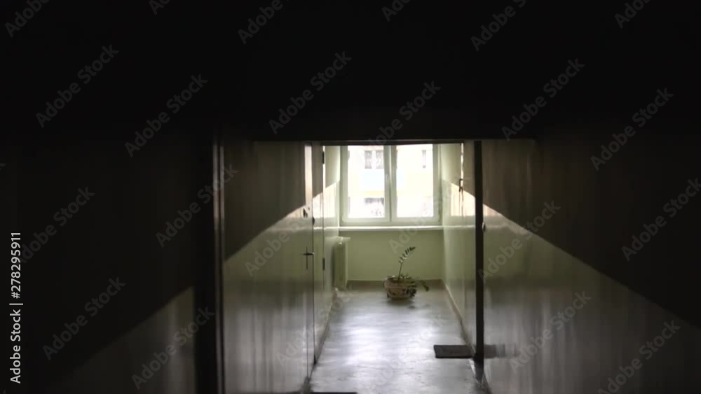 Static shot in the old dark empty corridor in the block, a stylized ...