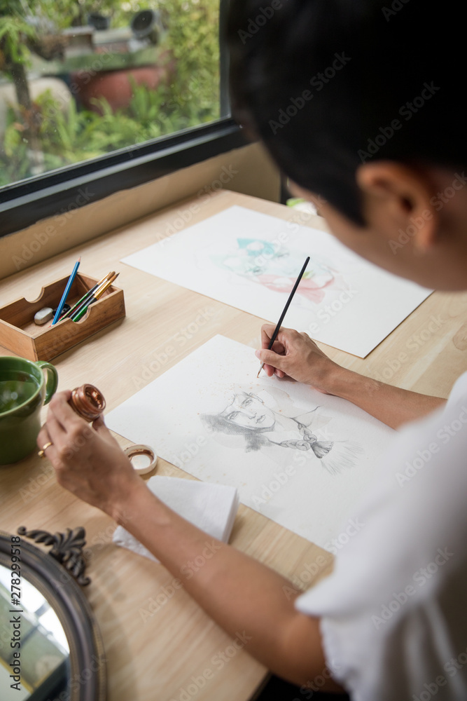 Artist sketching on a white paper Stock Photo | Adobe Stock